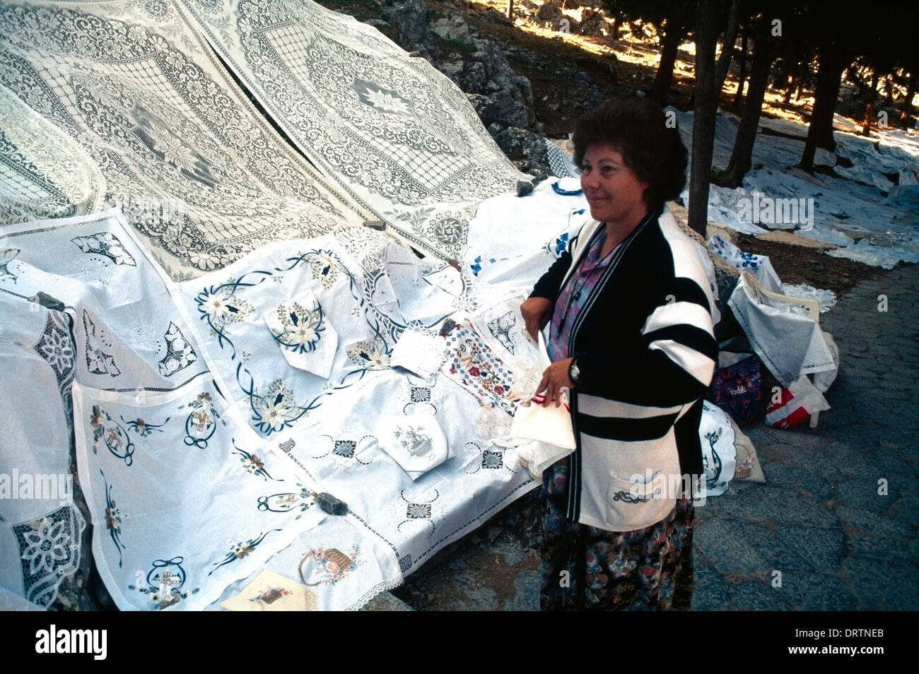 Rhodes Greece Lindos Woman Selling Table Cloths Stock Photo - Alamy