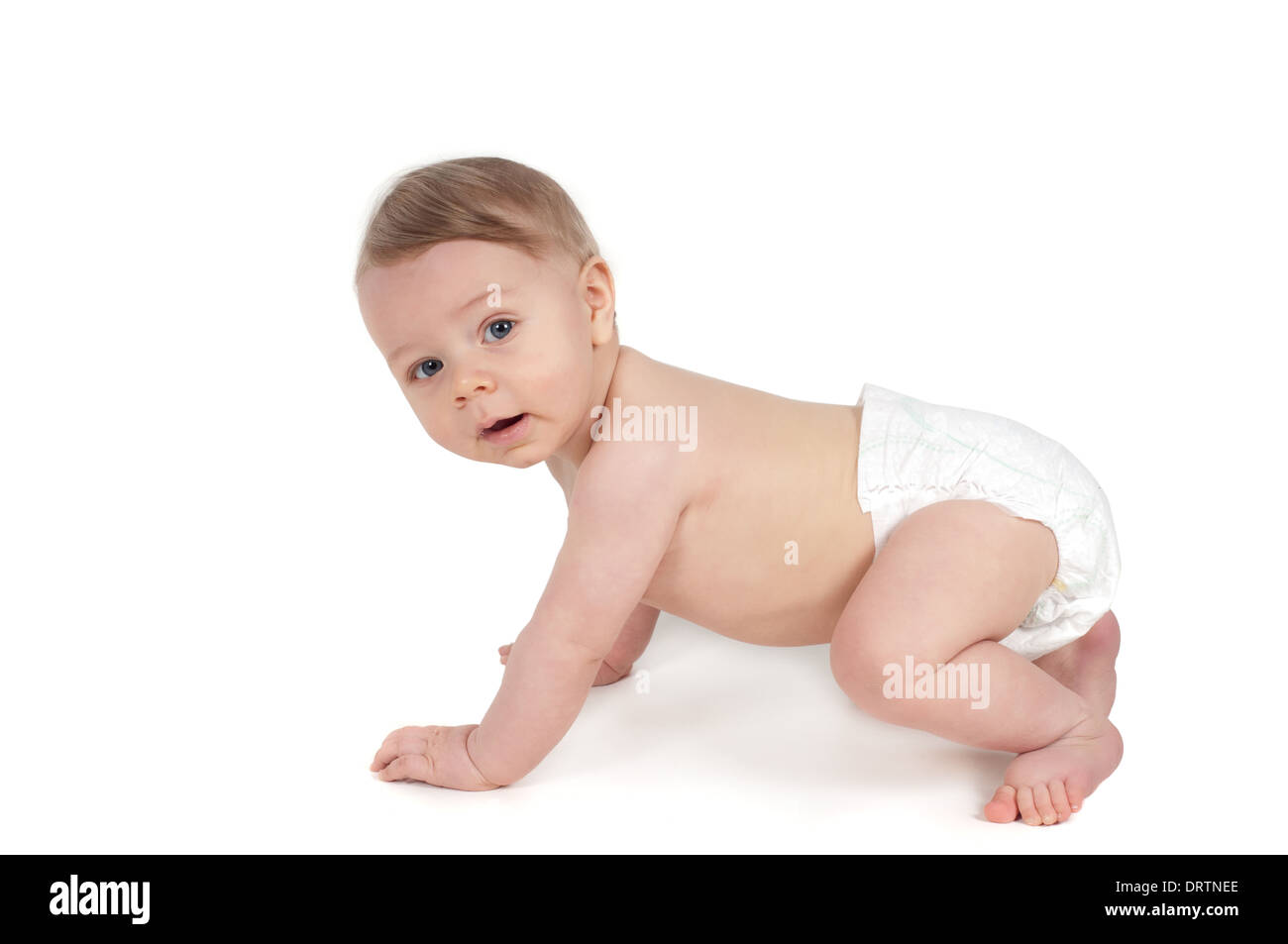 Side view of cute small crawling baby Stock Photo - Alamy