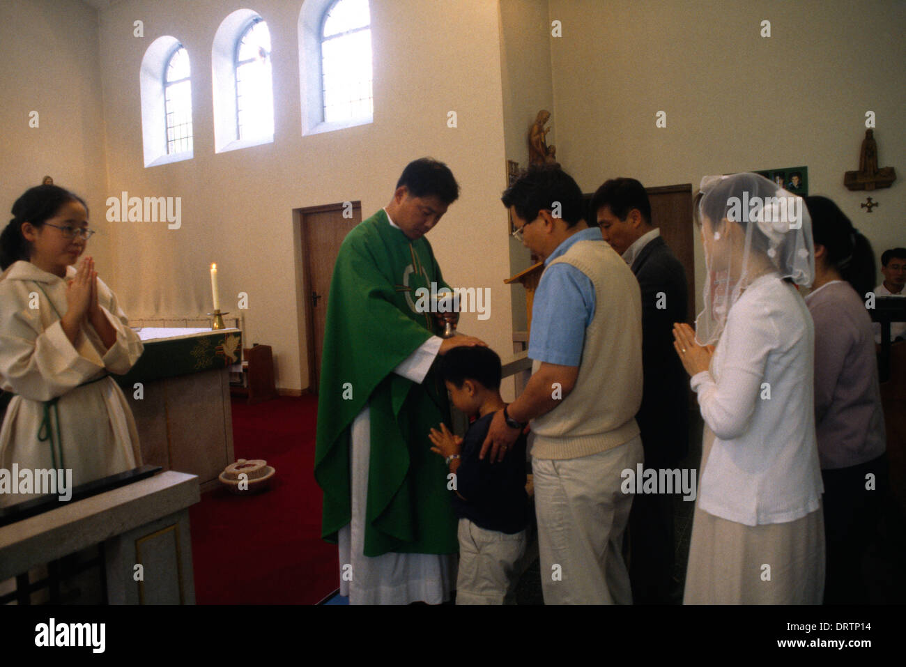 Priest communion hi-res stock photography and images - Alamy