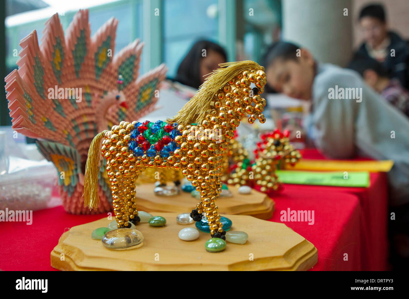 Toronto, Canada. 1st Feb, 2014. Kids watch handicraft works on display ...