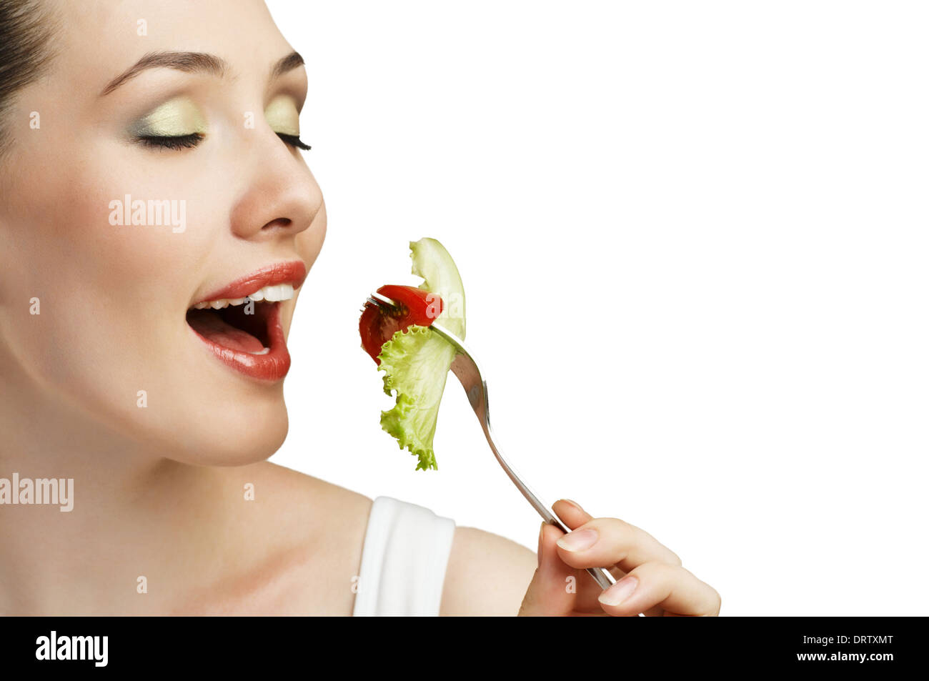A beautiful slender girl eating healthy food Stock Photo - Alamy