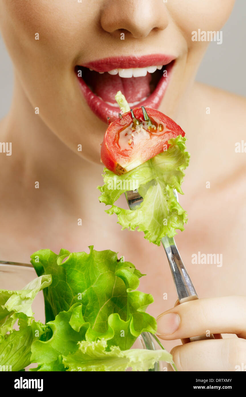 A beautiful slender girl eating healthy food Stock Photo - Alamy