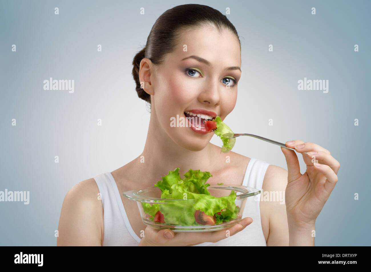 A beautiful slender girl eating healthy food Stock Photo - Alamy