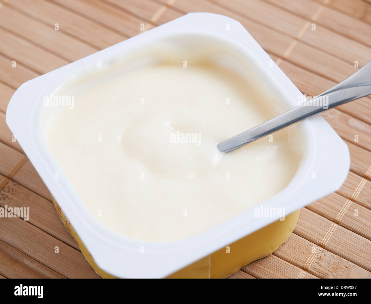 Vanilla custard in plastic container hi-res stock photography and ...