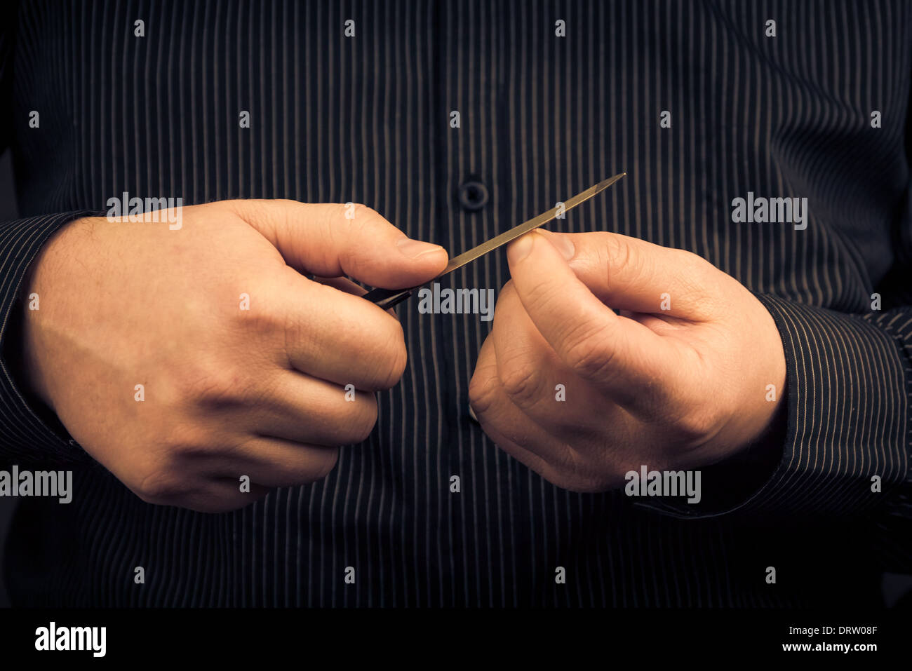 Care of hands. Polishing fingernails with the nail file Stock Photo - Alamy