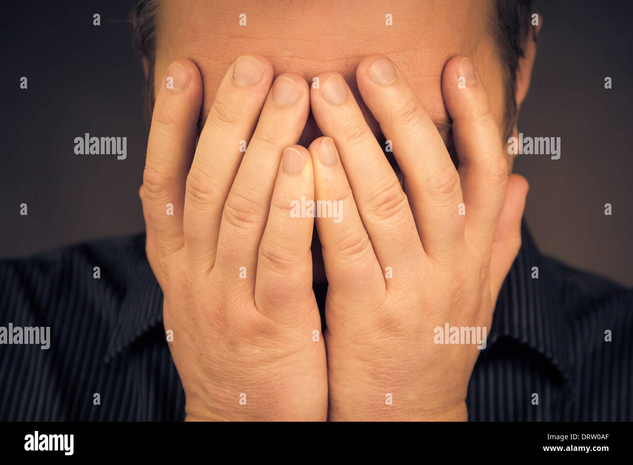 Crying white man with hands on face Stock Photo - Alamy