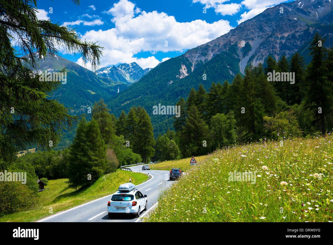 Cars on touring holiday in the Swiss Alps, Swiss National Park ...
