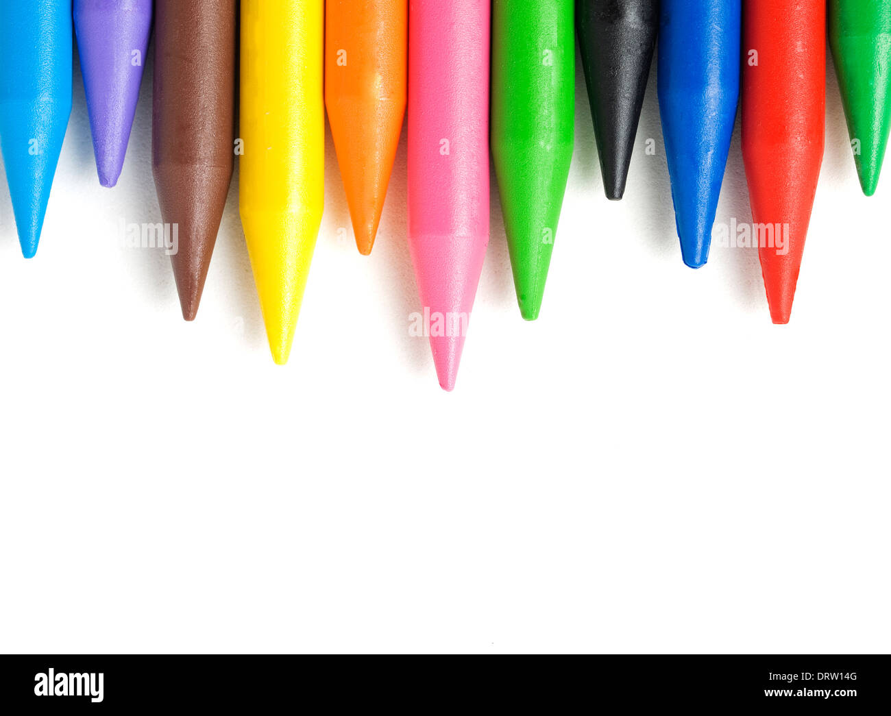 A stack of colorful crayons on an isolated white background Stock Photo - Alamy