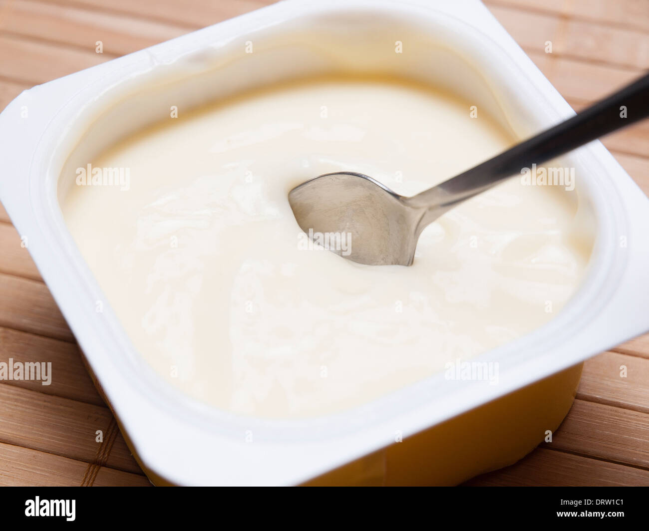 Vanilla custard in plastic container hi-res stock photography and ...