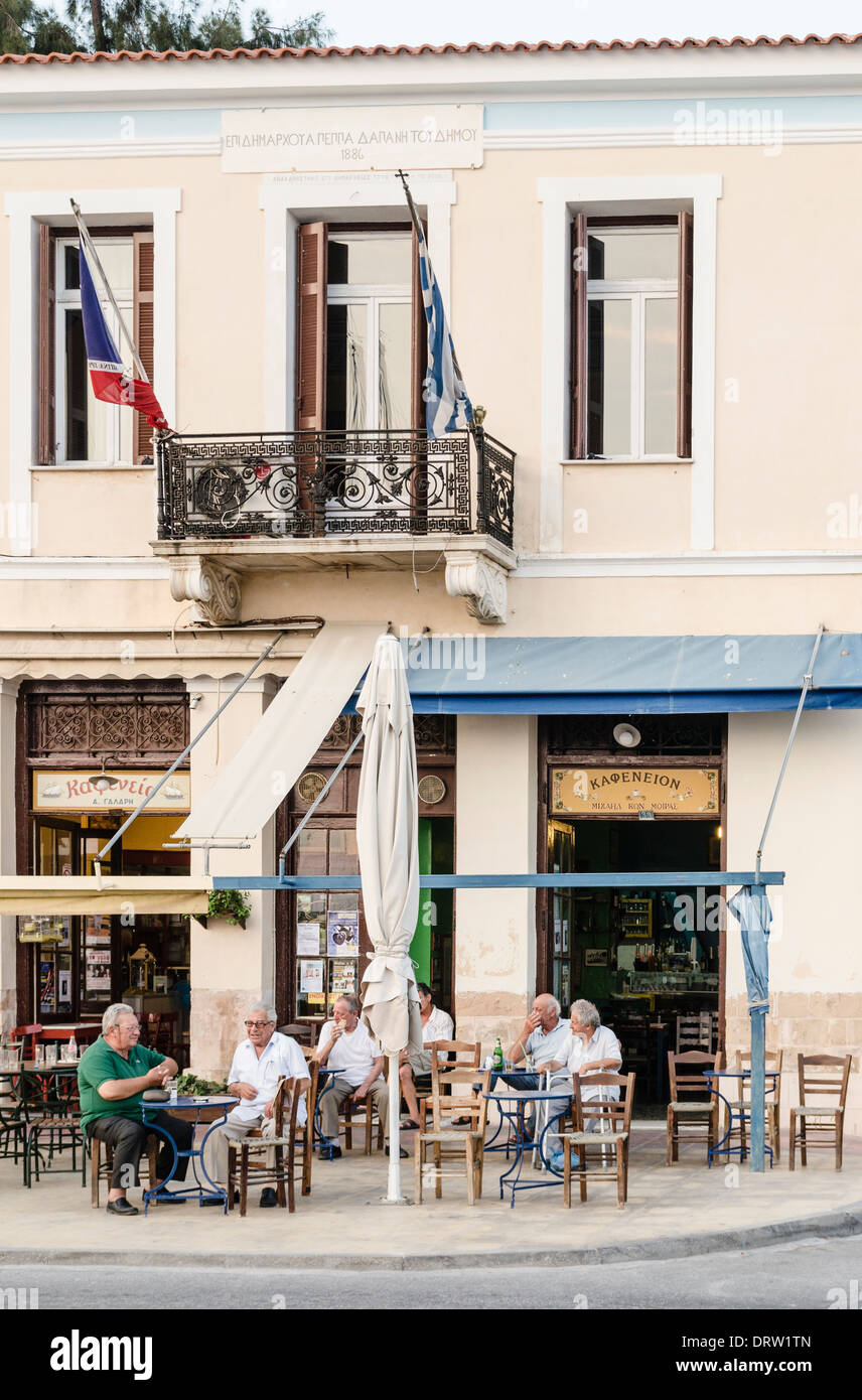 Old men seated outside a kafenio in Aegina Town, Aegina Island, Greece ...