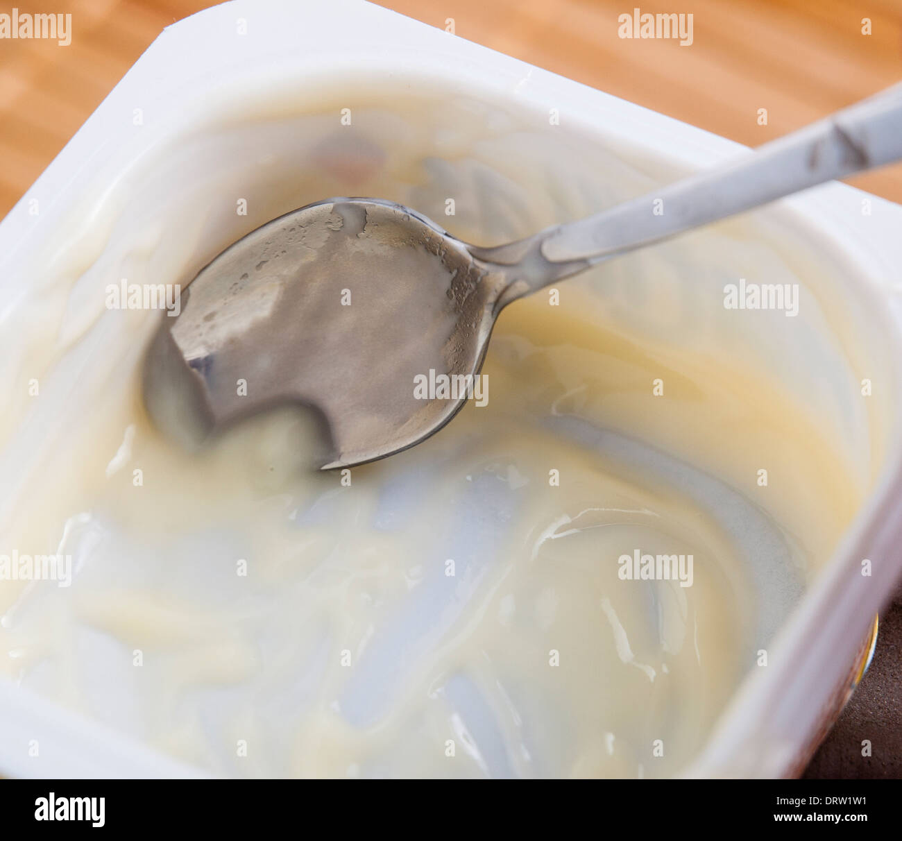 Vanilla custard in plastic container hi-res stock photography and ...