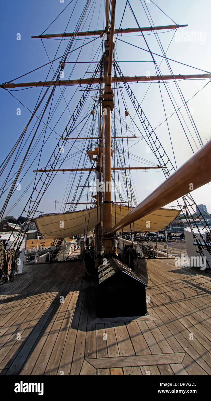 The tall masts and planked deck of a Victorian naval gunboat - one of ...
