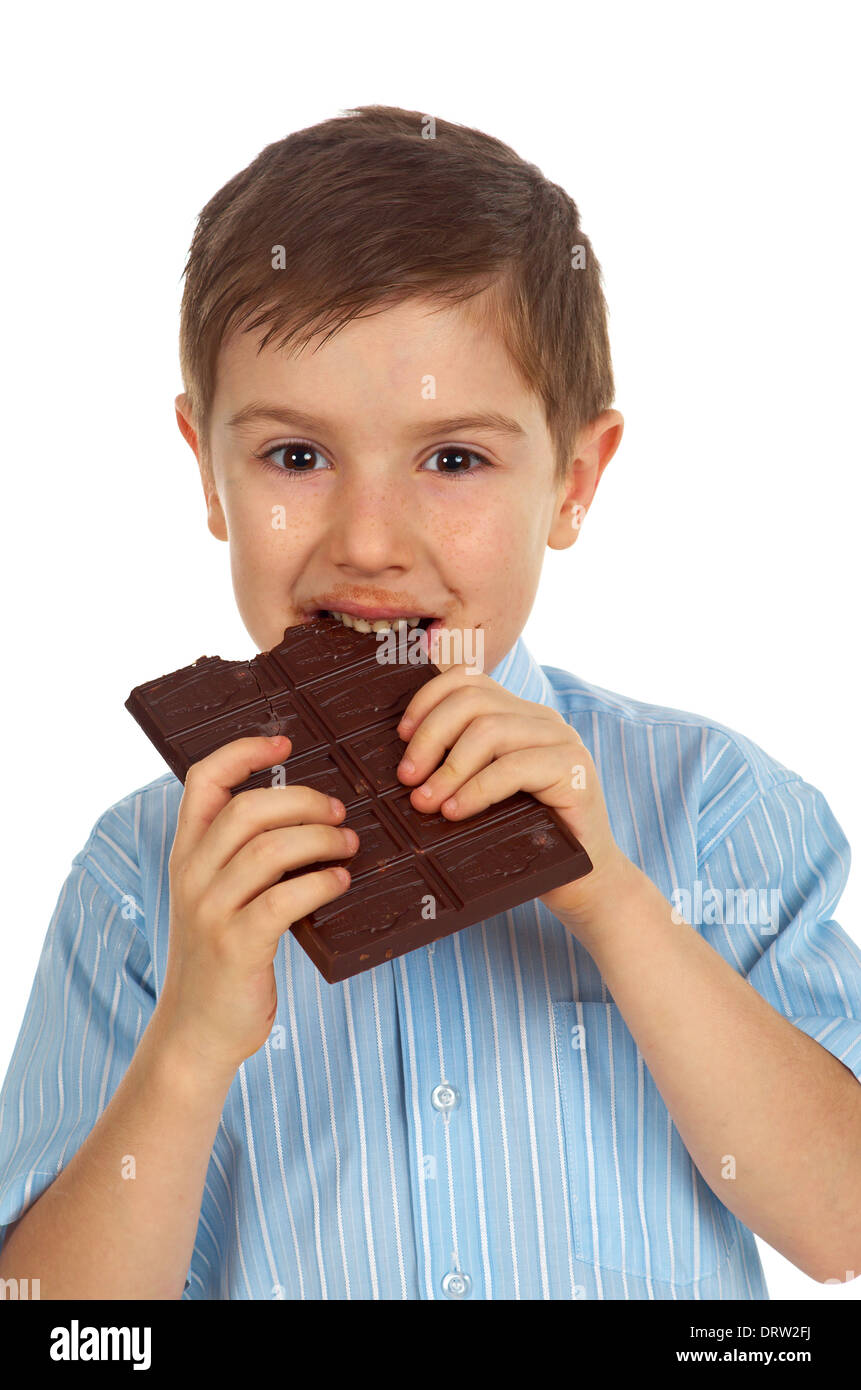 Smiling funny young kid eating chocolate.White isolated Stock Photo - Alamy