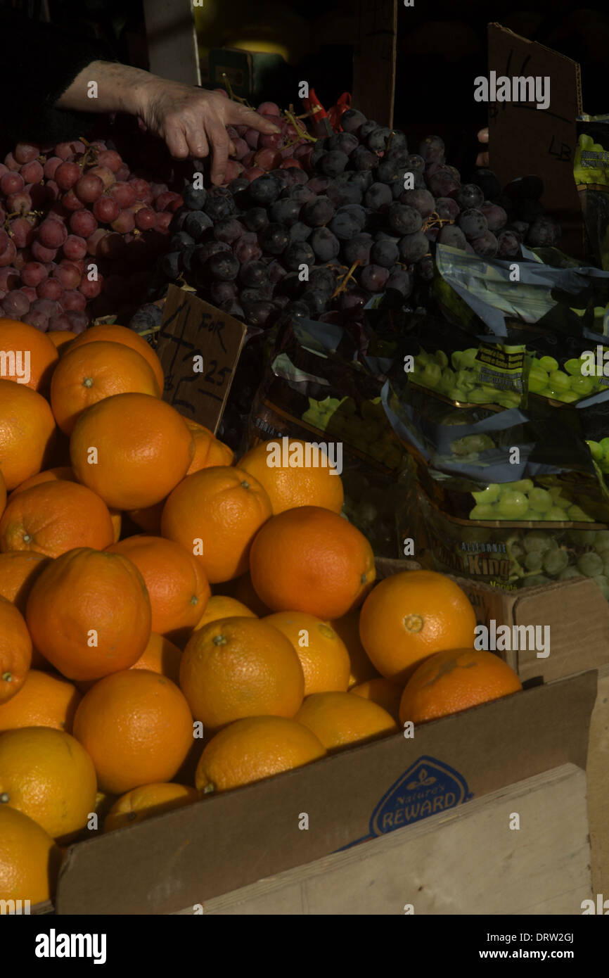 Farmer Market Fruit boxes with female hand Stock Photo - Alamy