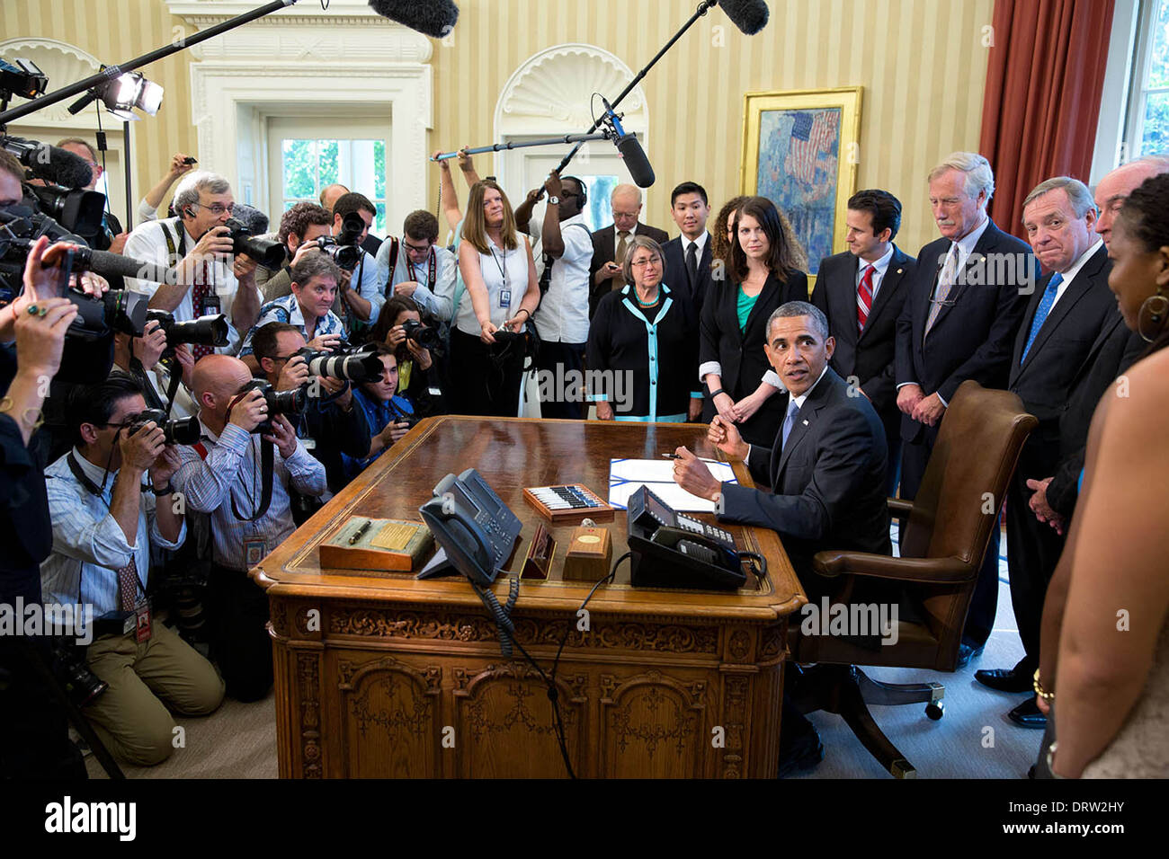 US President Barack Obama looks back towards a group of students before ...