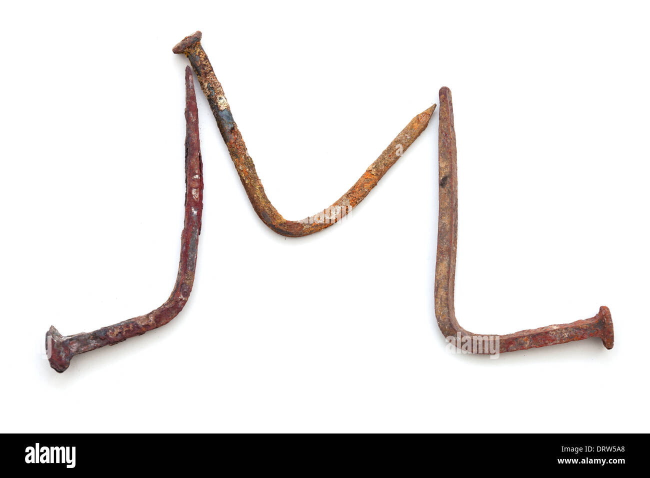 forged nails letters - old rusty bent nails in shape of letters ...