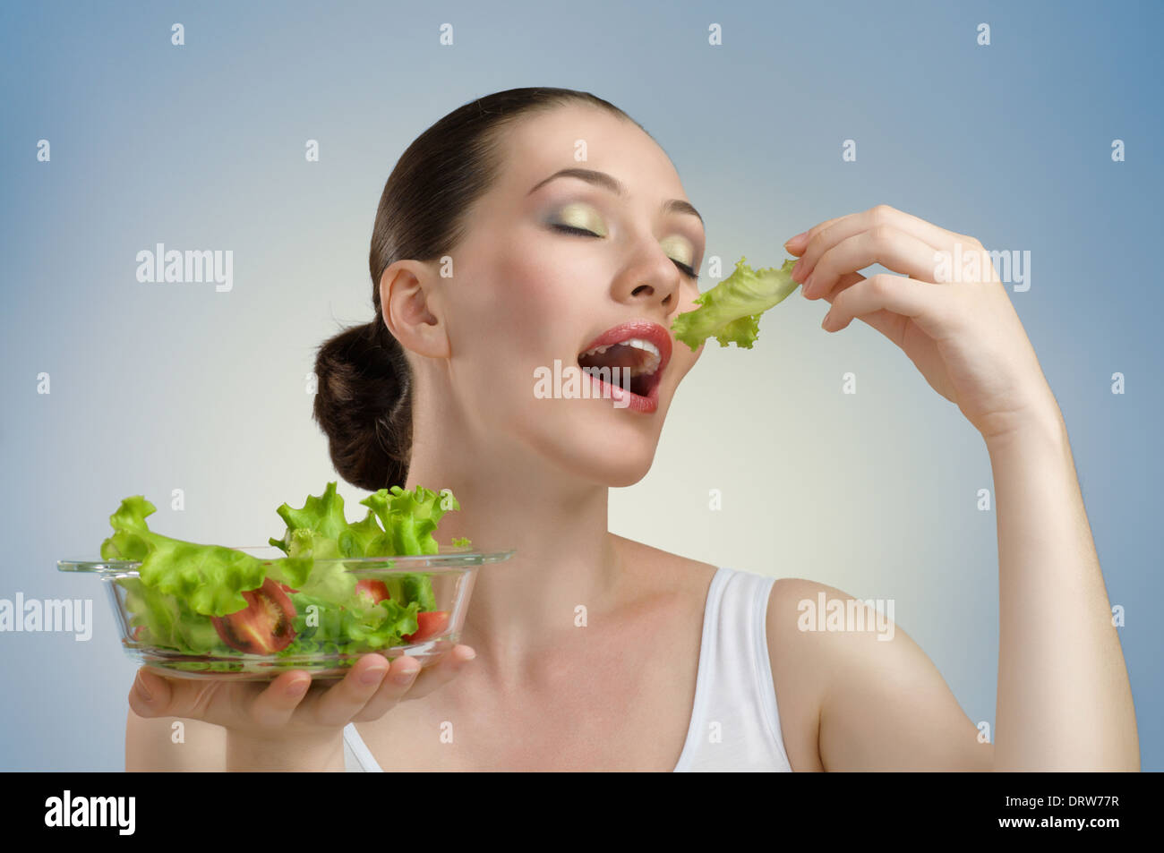 A beautiful slender girl eating healthy food Stock Photo - Alamy