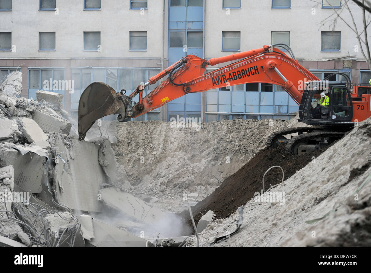 Workers start with the clearing work of the rubble tip of the blown up ...