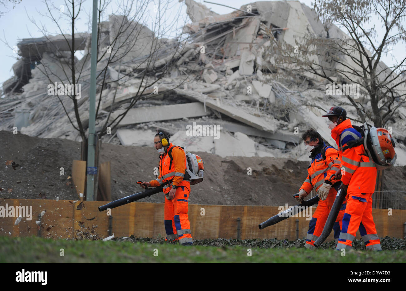 Workers start with the clearing work of the rubble tip of the blown up ...