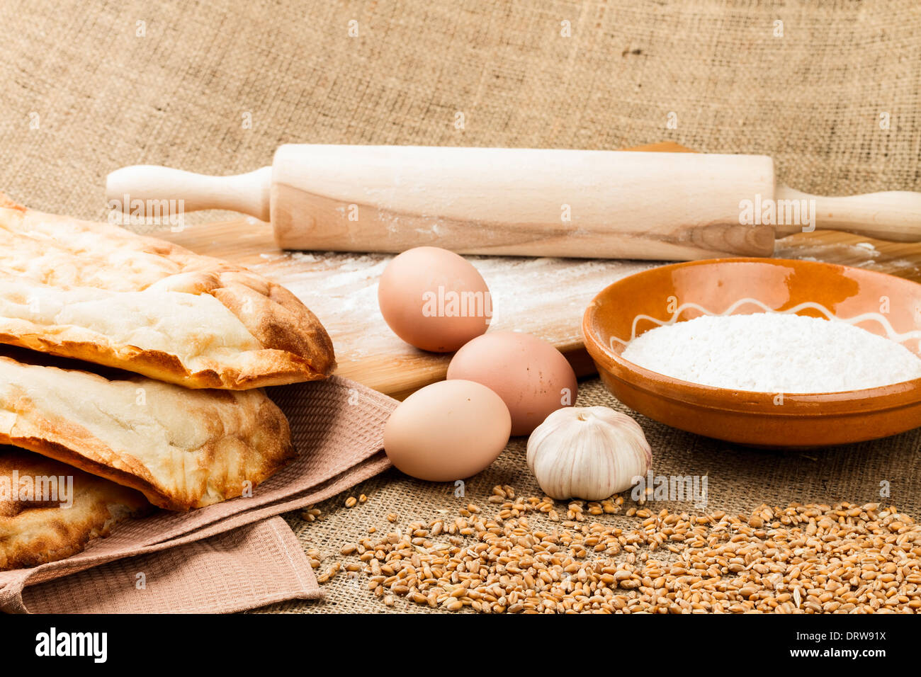 fresh pita bread isolated on sacking background Stock Photo - Alamy