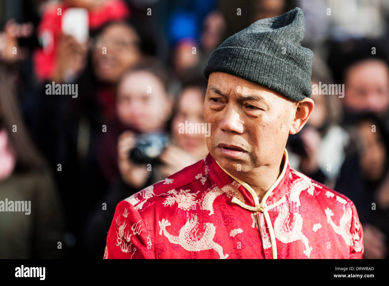 Charing Cross Rd, London, UK. 2nd February 2014. A Chinese man looking ...