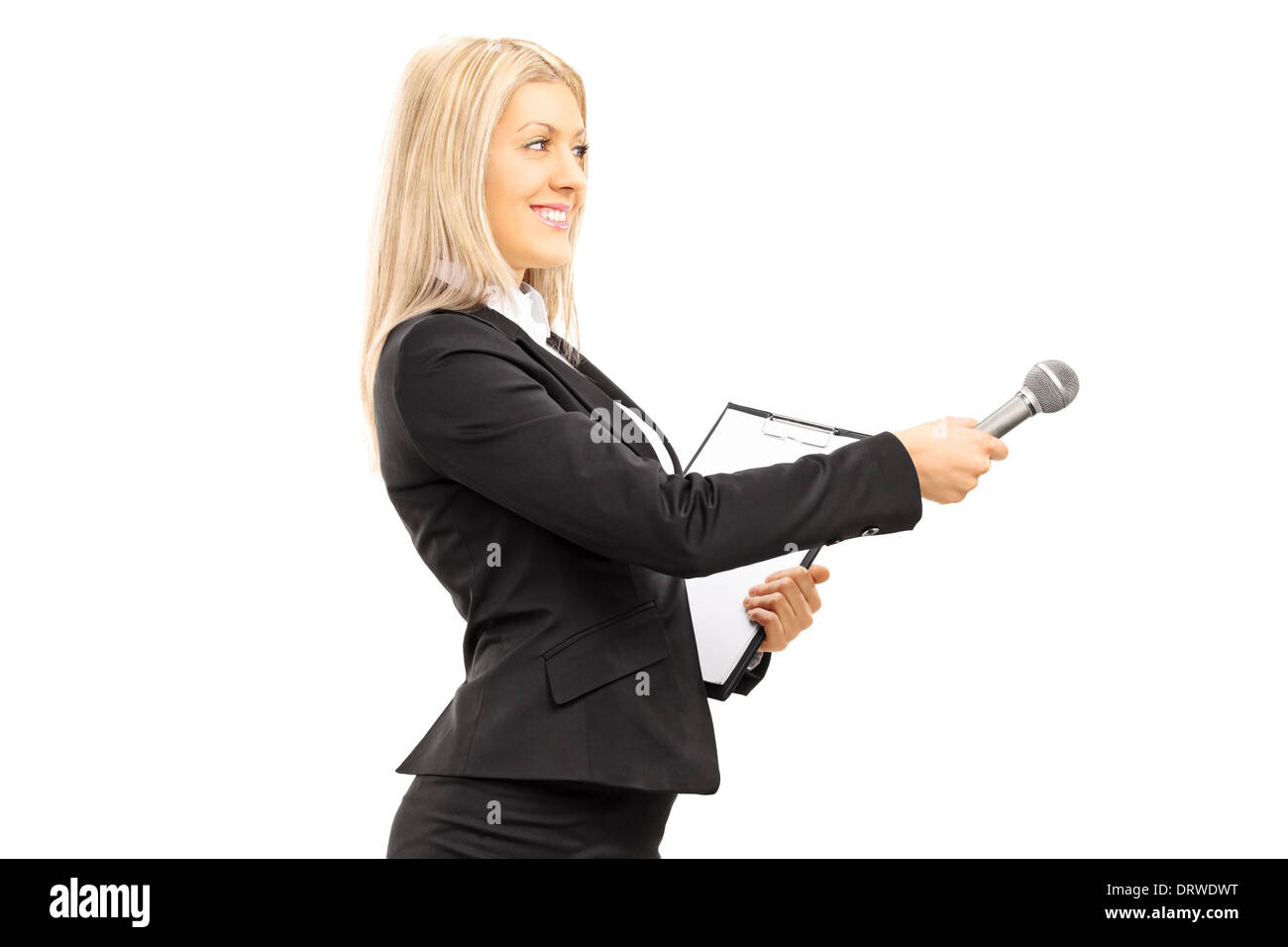 Young female interviewer holding a microphone Stock Photo - Alamy