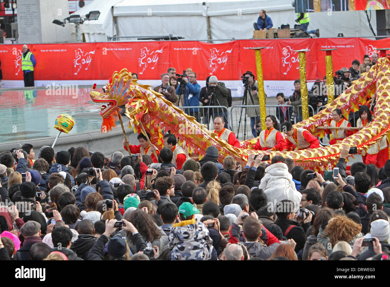 London, UK. 2nd Feb, 2014. A colourful dragon dances in front of crowds ...