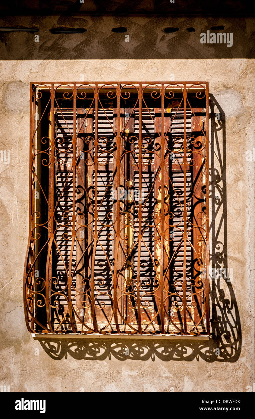 Window with ornate rusty metal grill, Tunisia Stock Photo - Alamy