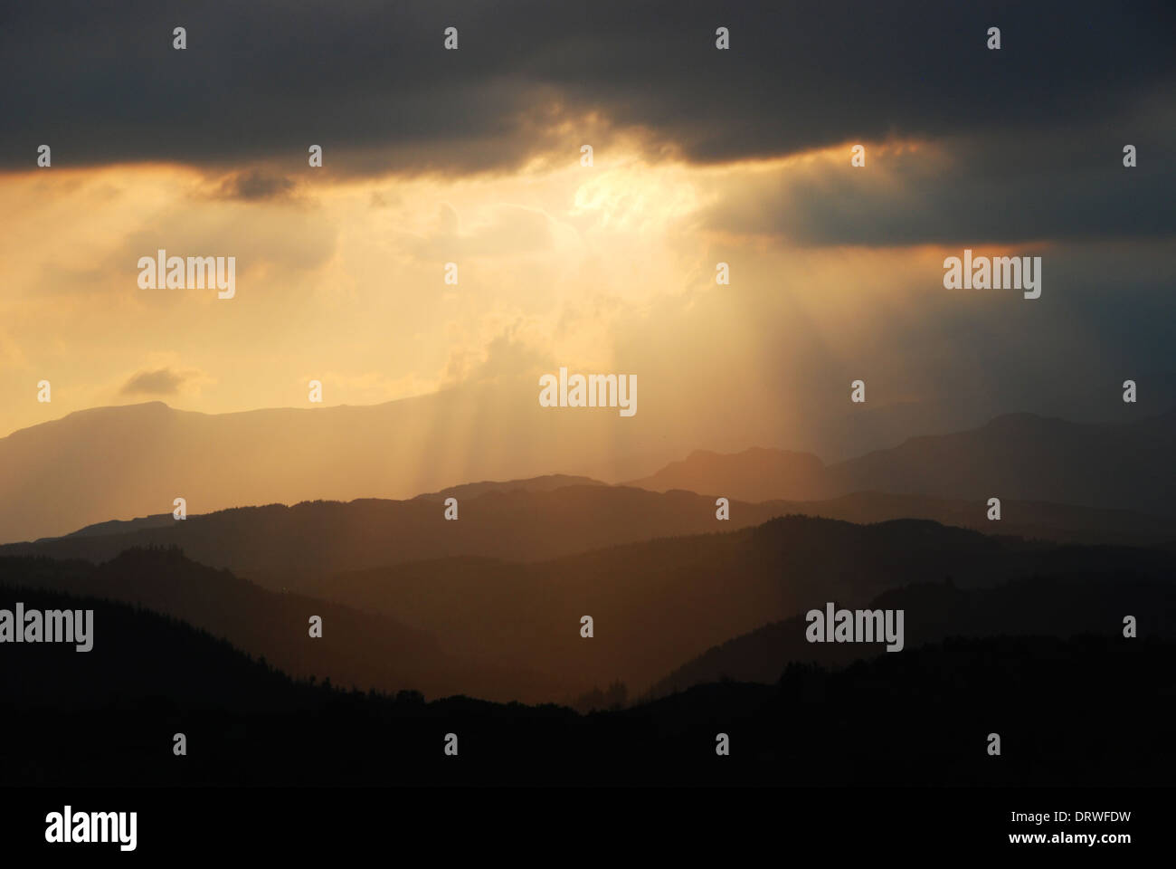 Sun through mountains hi-res stock photography and images - Alamy