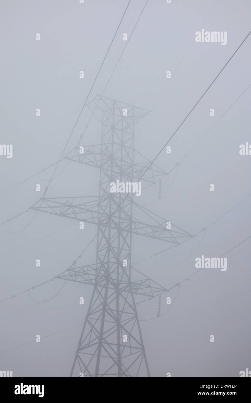 Power lines tower in the fog Stock Photo - Alamy