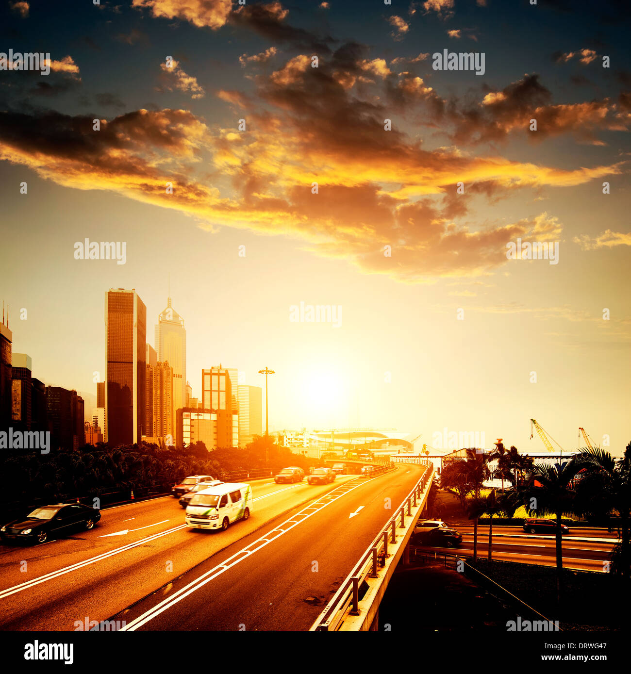 Highway heading to the city Stock Photo - Alamy