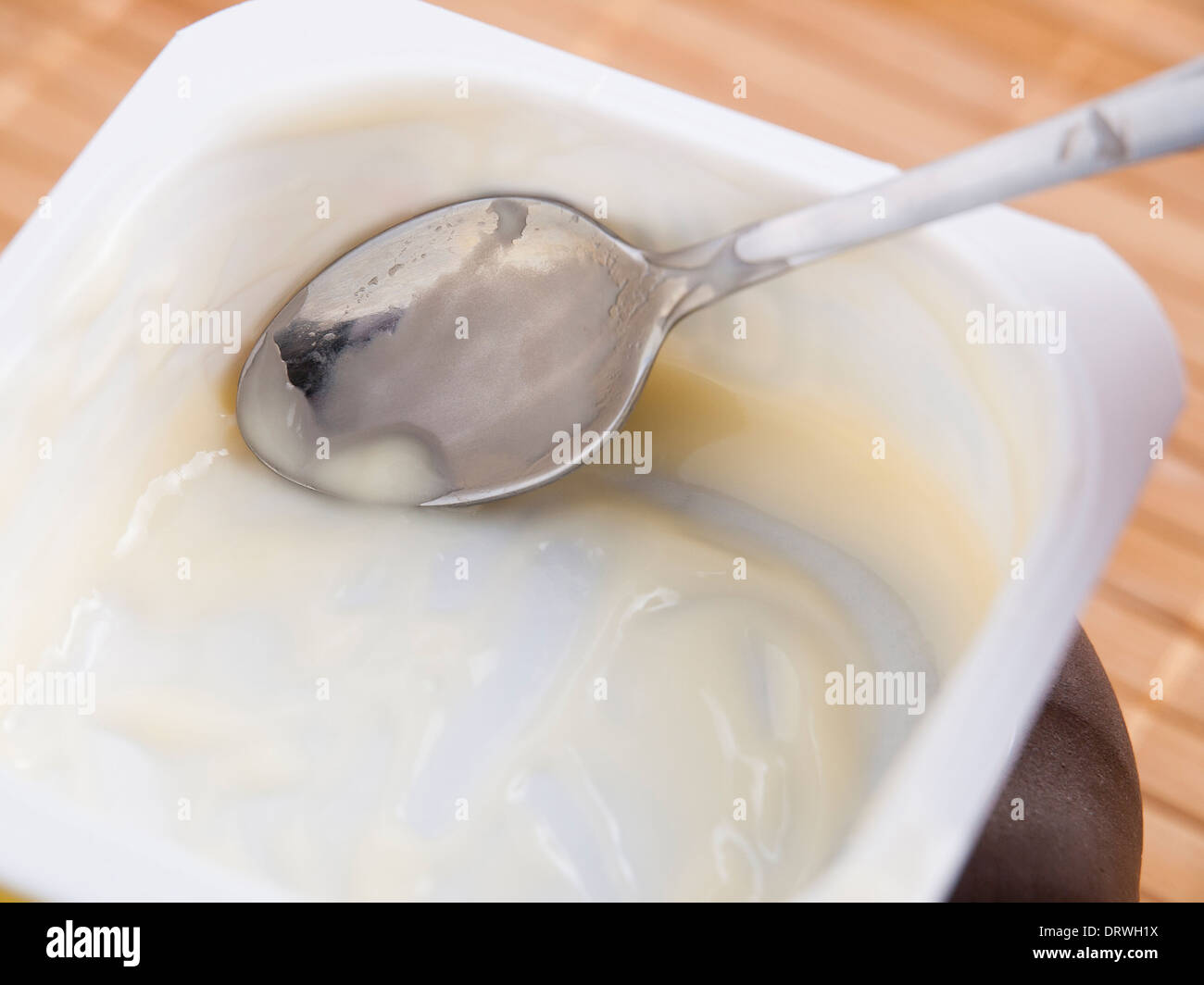 Vanilla custard in plastic container hi-res stock photography and ...