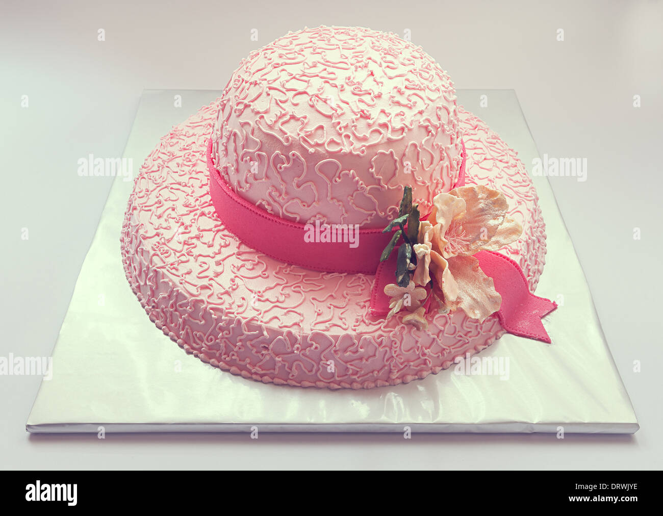 Birthday cake, looks like hat, in pink color and flower made of sugar ...