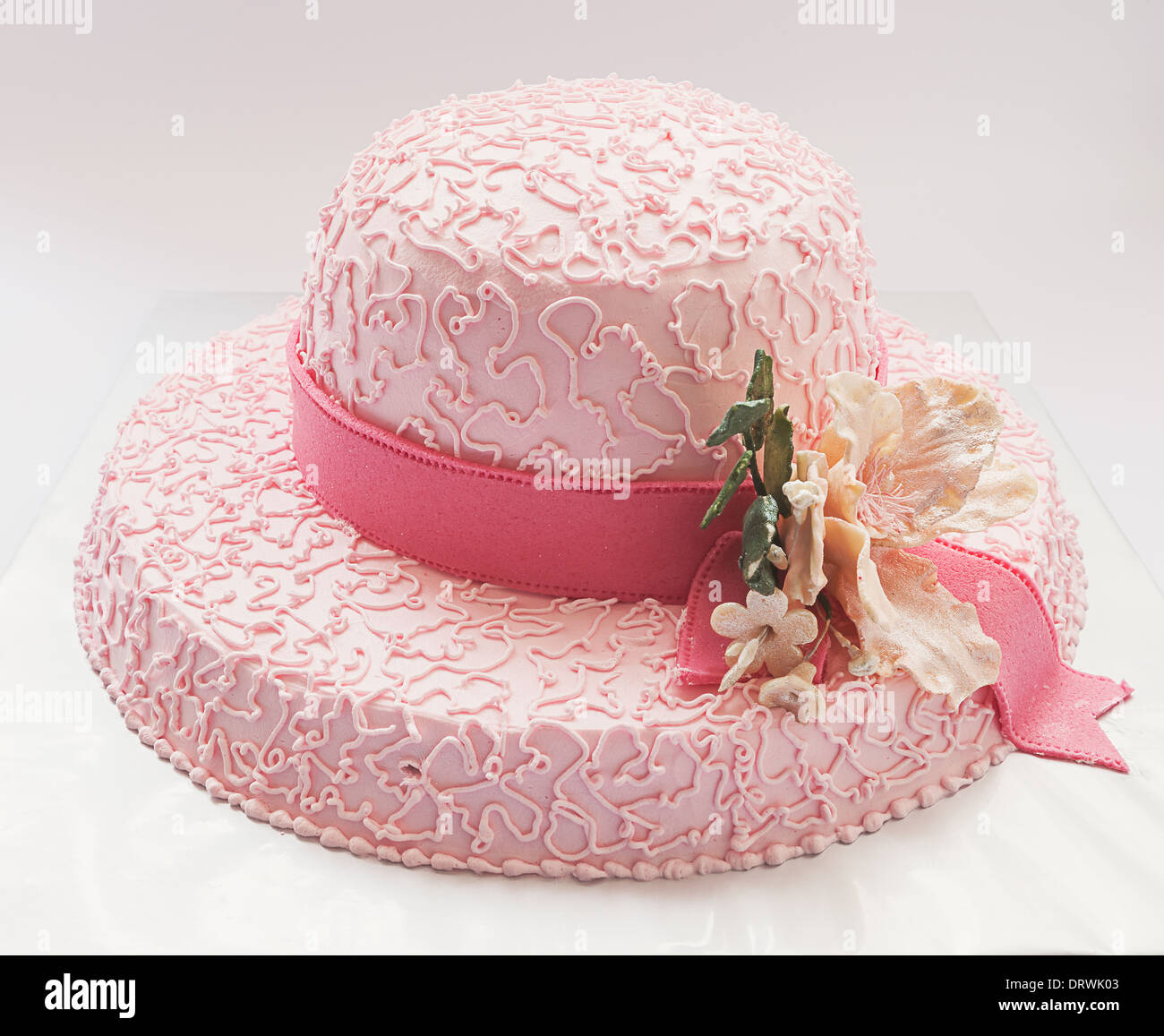 Birthday cake, looks like hat, in pink color and flower made of sugar ...