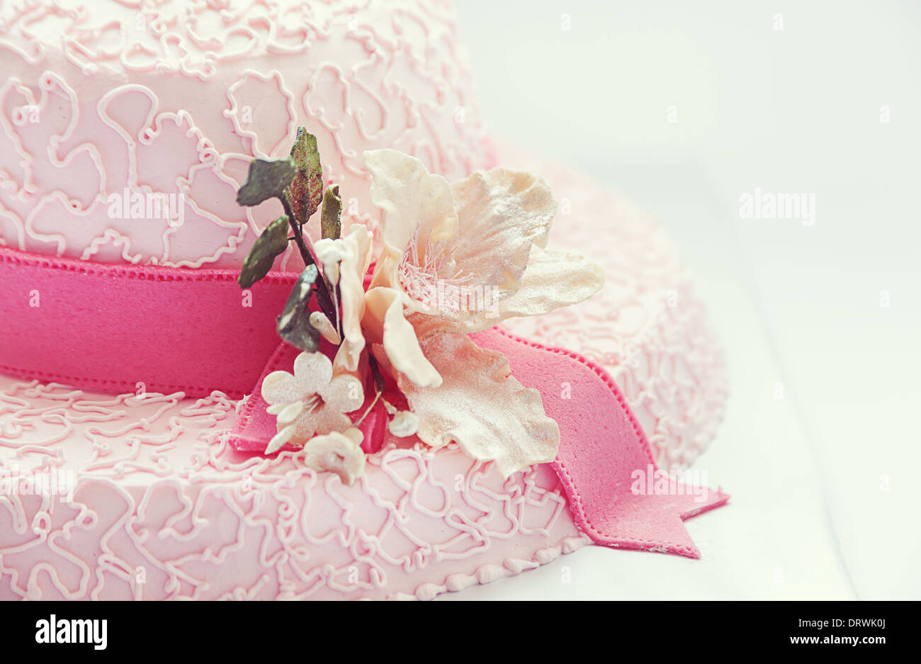 Birthday cake, looks like hat, in pink color and flower made of sugar ...