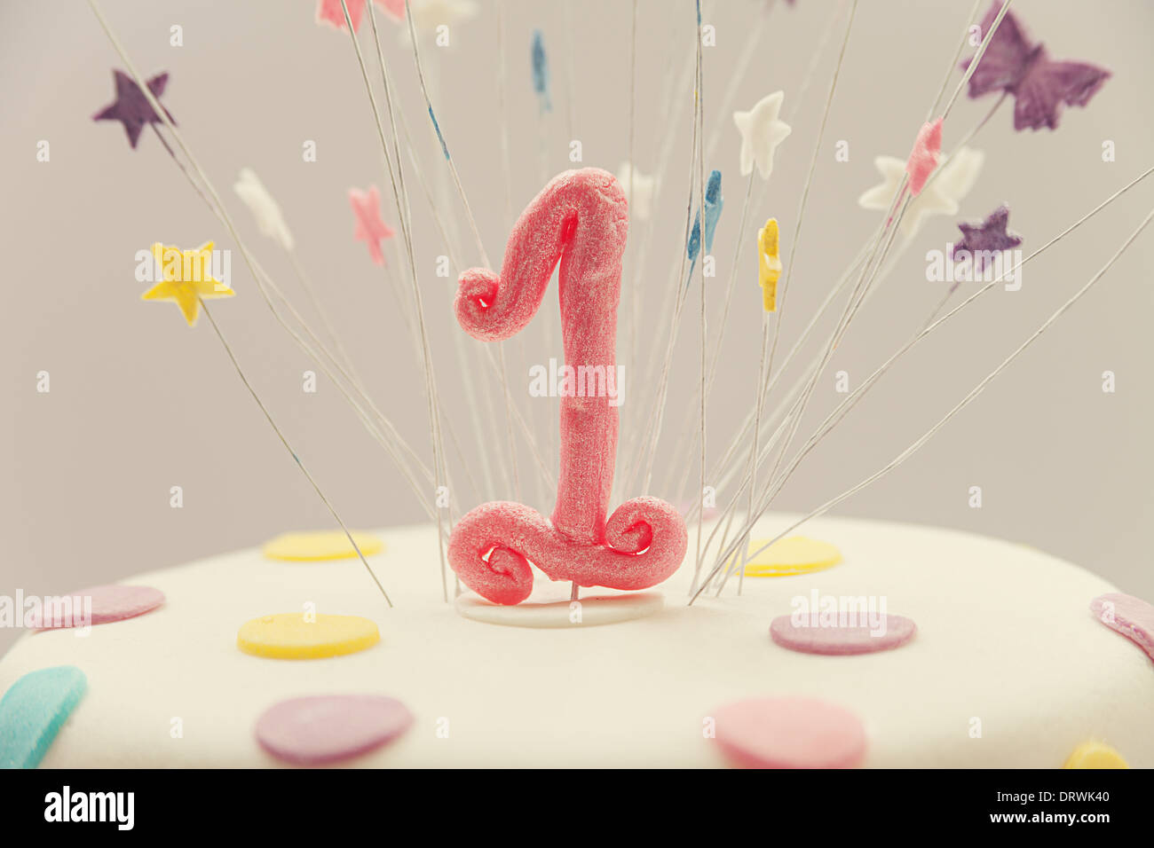 Cake for first birthday, number one made of sugar on top with stars ...