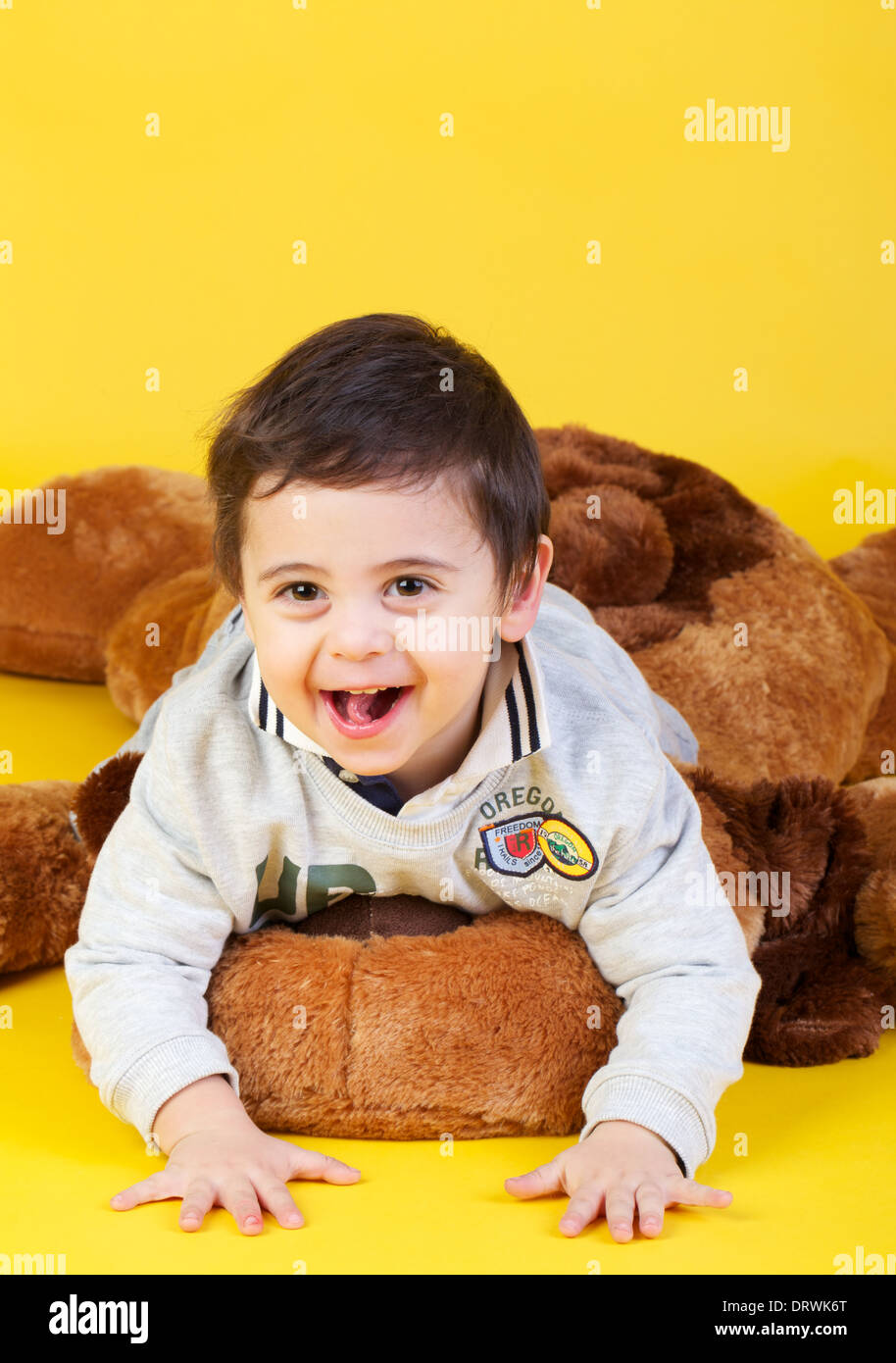 child isolated on yellow background Stock Photo - Alamy