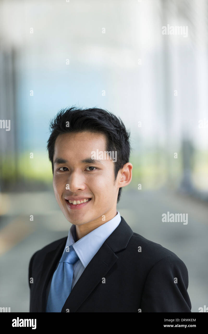 Chinese business man in modern Asian city Stock Photo - Alamy