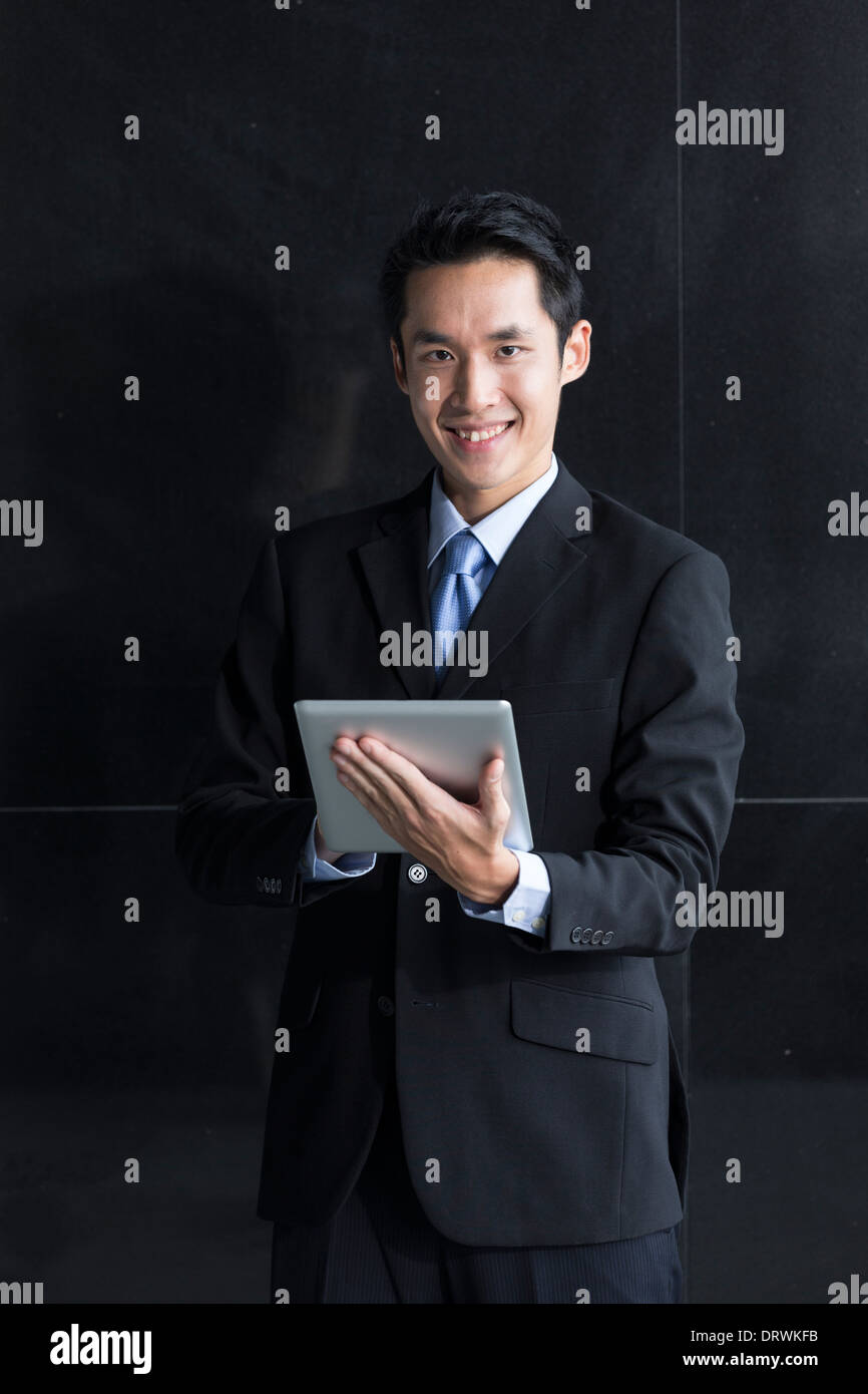 Chinese Man With A Tablet Computer Asian Business Man Using Digital