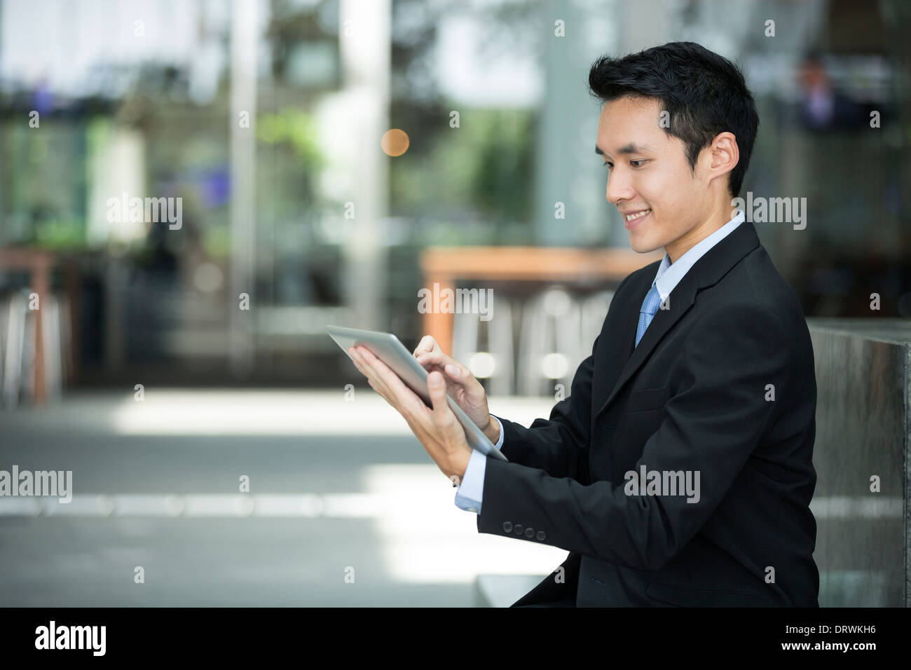 Chinese man with a tablet computer. Asian business man using digital ...
