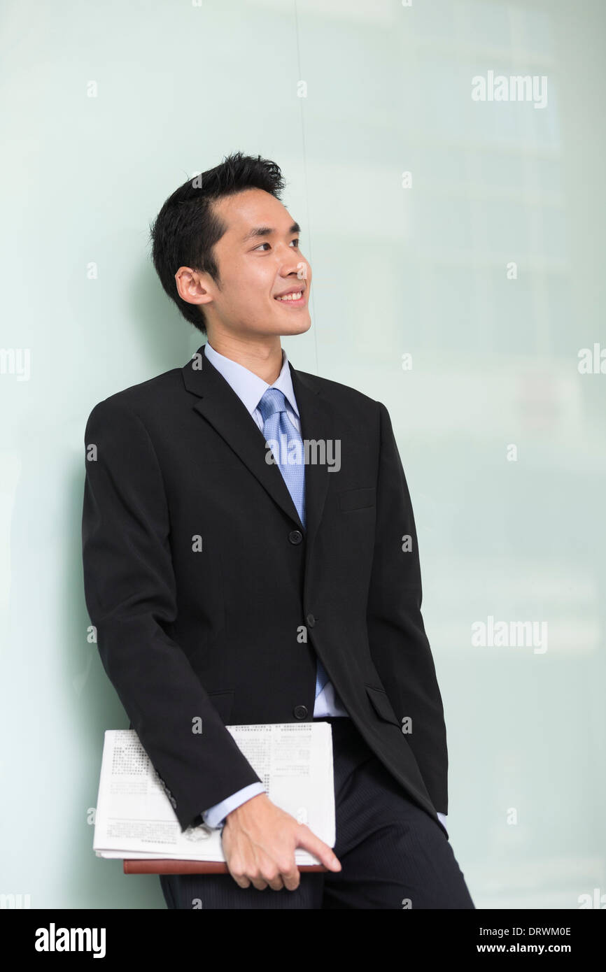 Chinese business man in modern Asian city Stock Photo - Alamy