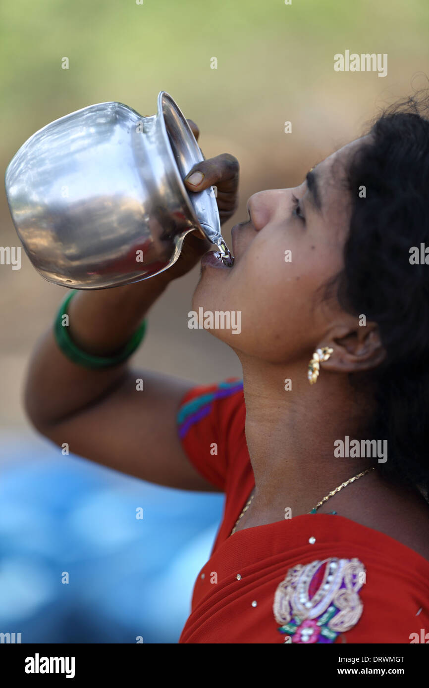 Indian woman drinking water india hi-res stock photography and images ...