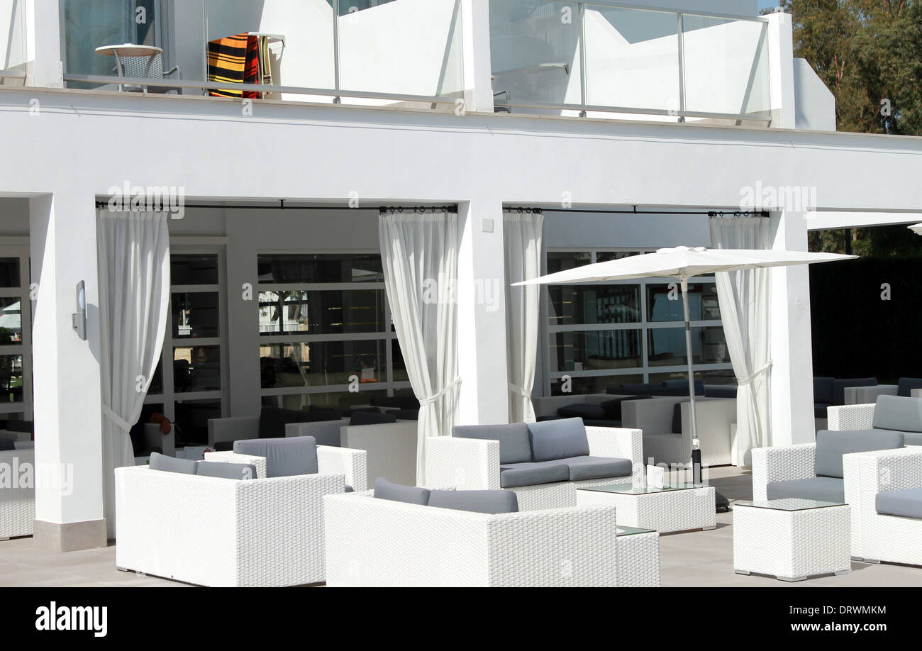 Luxurious patio area outside hotel with chairs and sofas Stock Photo ...