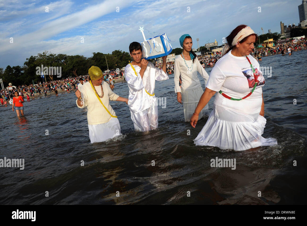 Montevideo, Uruguay. 2nd Feb, 2014. Residents carry offerings for ...