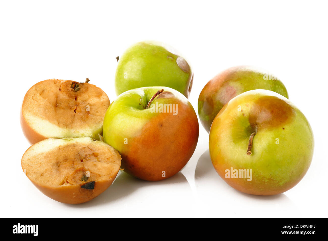 Rotten apples on white background Stock Photo - Alamy
