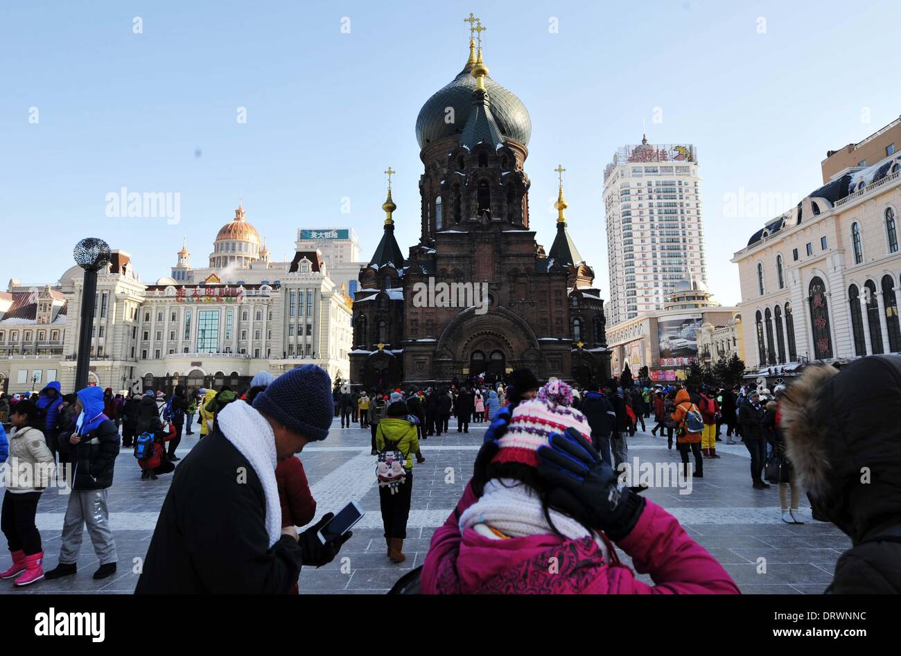 Harbin, China's Heilongjiang Province. 3rd Feb, 2014. Visitors in cold ...