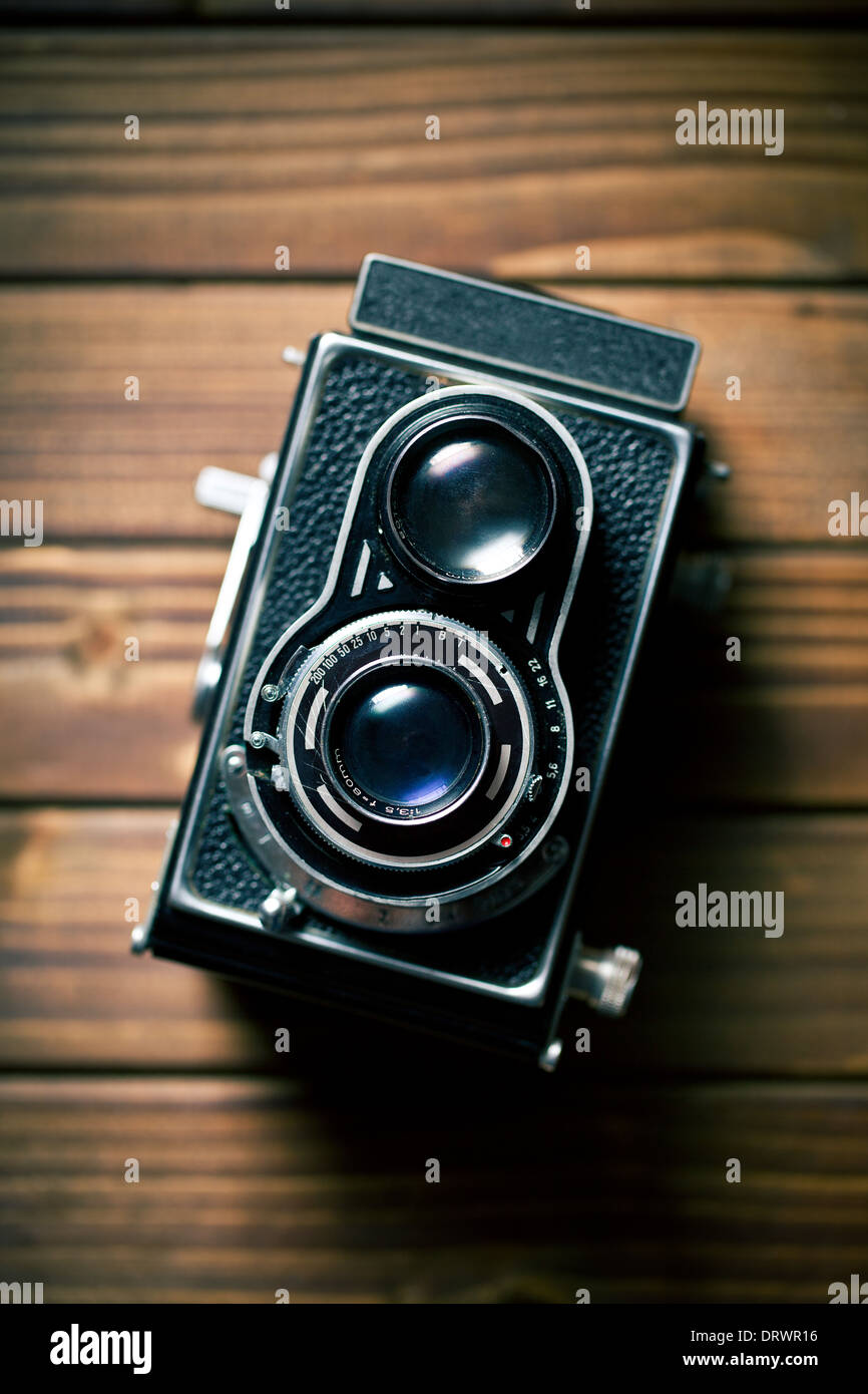 top view of antique camera on wooden background Stock Photo - Alamy