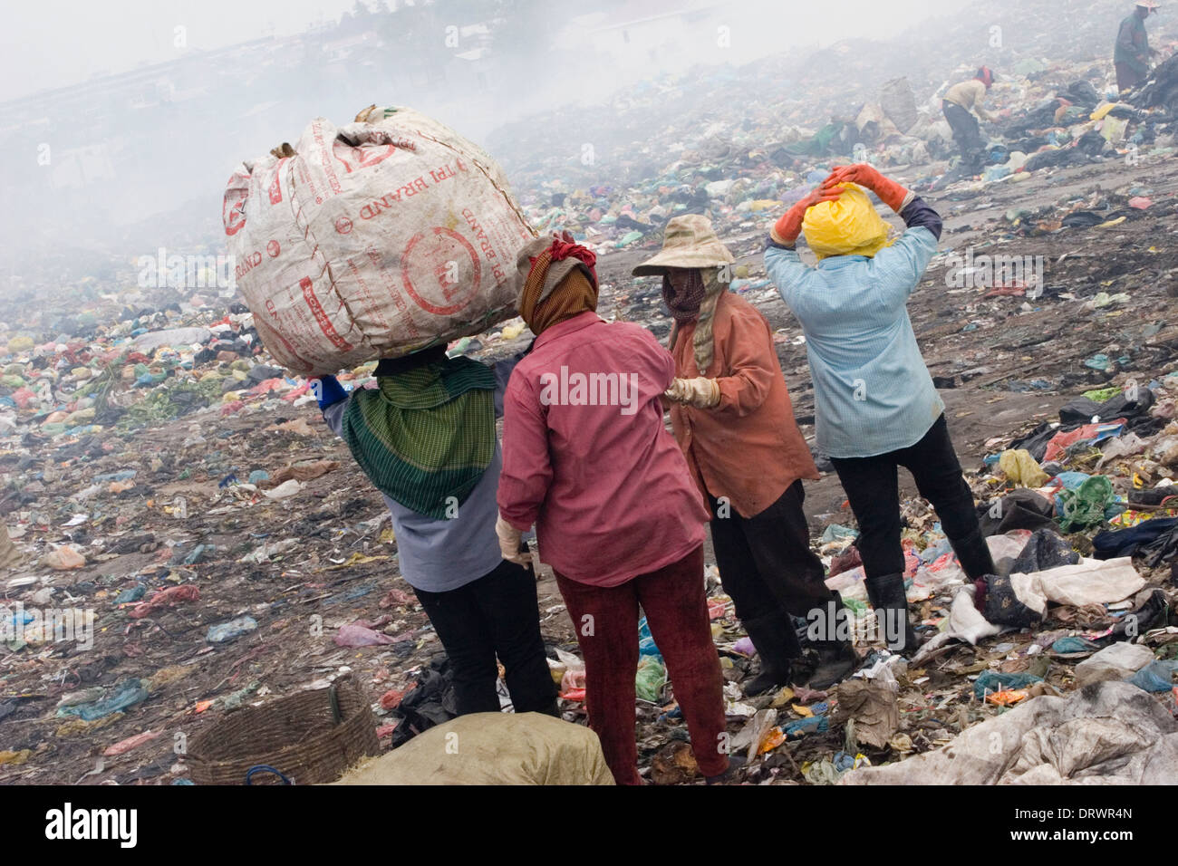 Plastic and rotting garbage provides the work environment for ...