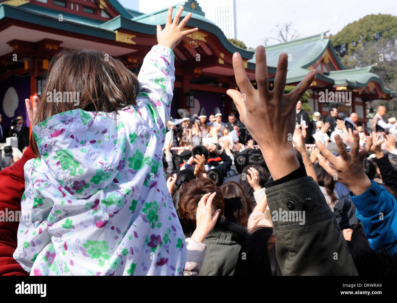 Tokyo, Japan. 3rd Feb, 2014. People attend a bean-throwing ceremony to ...