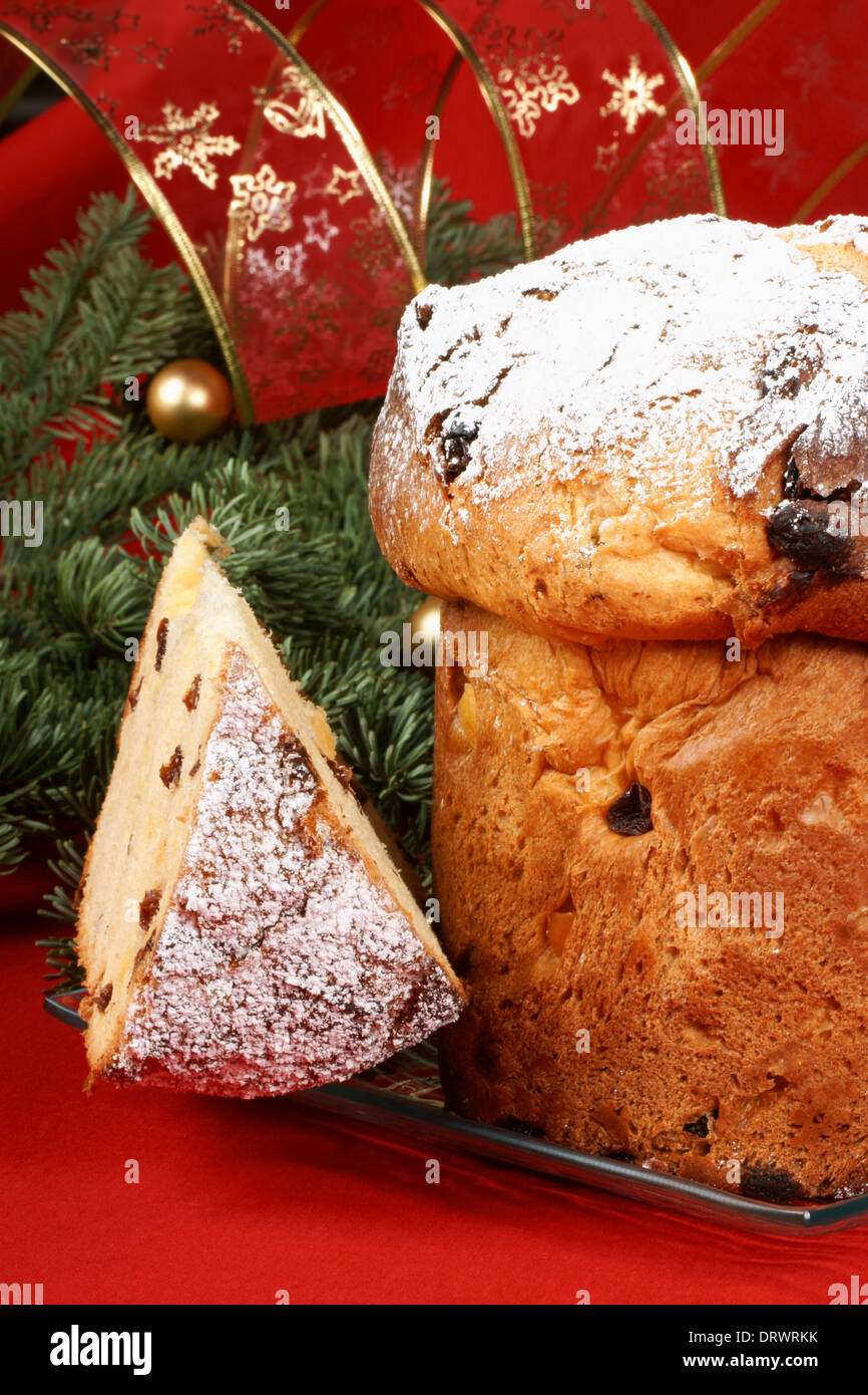 Panettone the italian Christmas fruit cake on a glass plate in front of ...